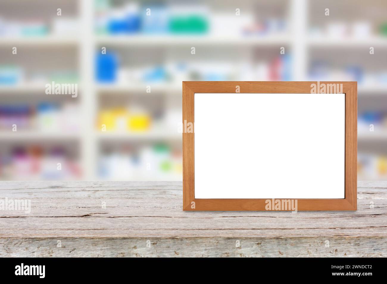 wood photo frame on the pharmacy counter over blur shelves of drug in ...