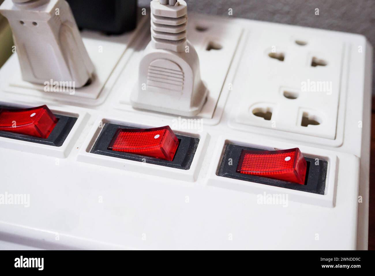 Multiple power socket with connected plugs Stock Photo - Alamy