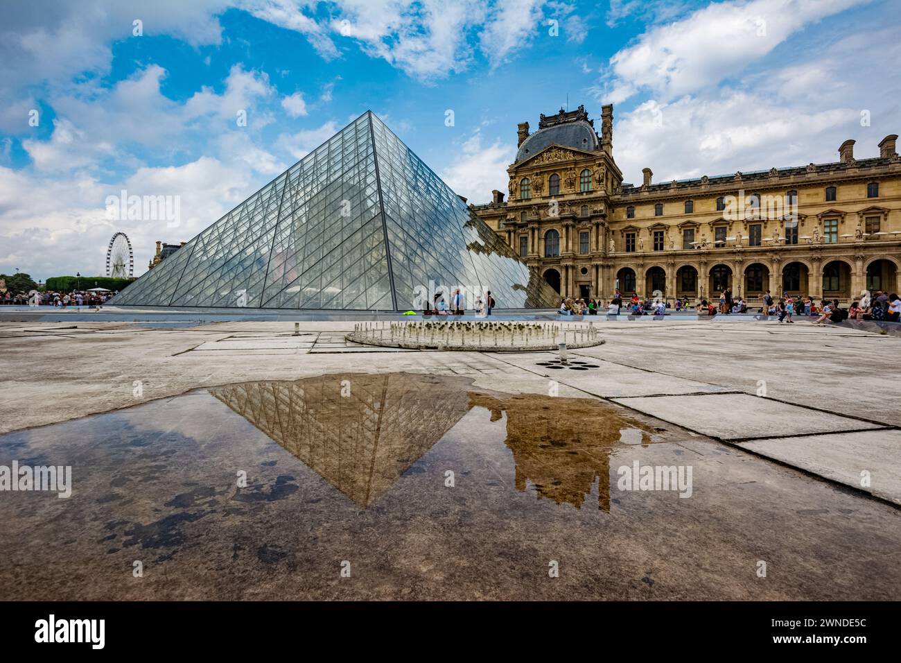 97 Tourists Visit The Pyramid Of The Louvre Stock Photos, High-Res