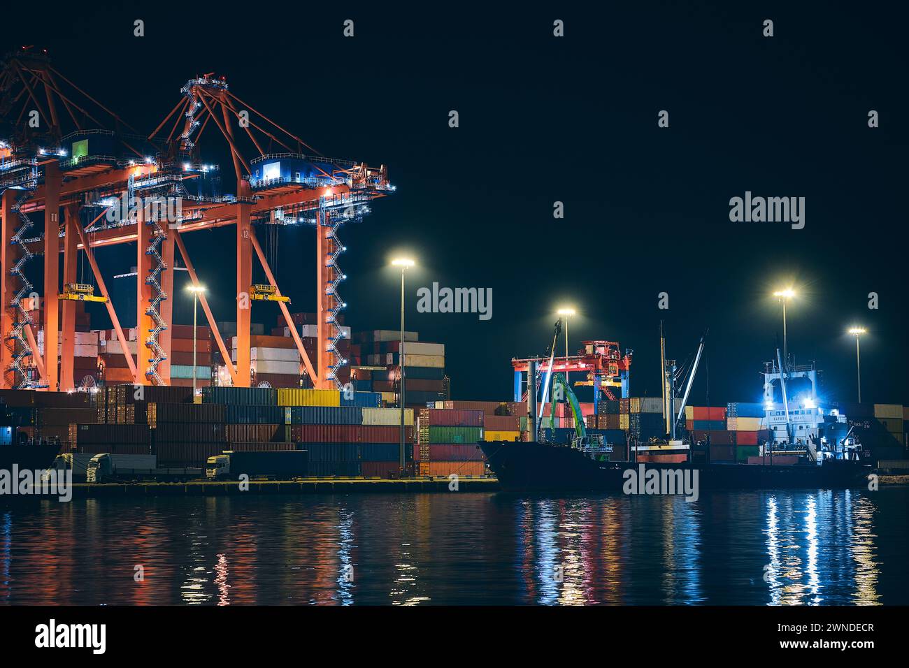 Cargo container terminal at sea port Stock Photo - Alamy