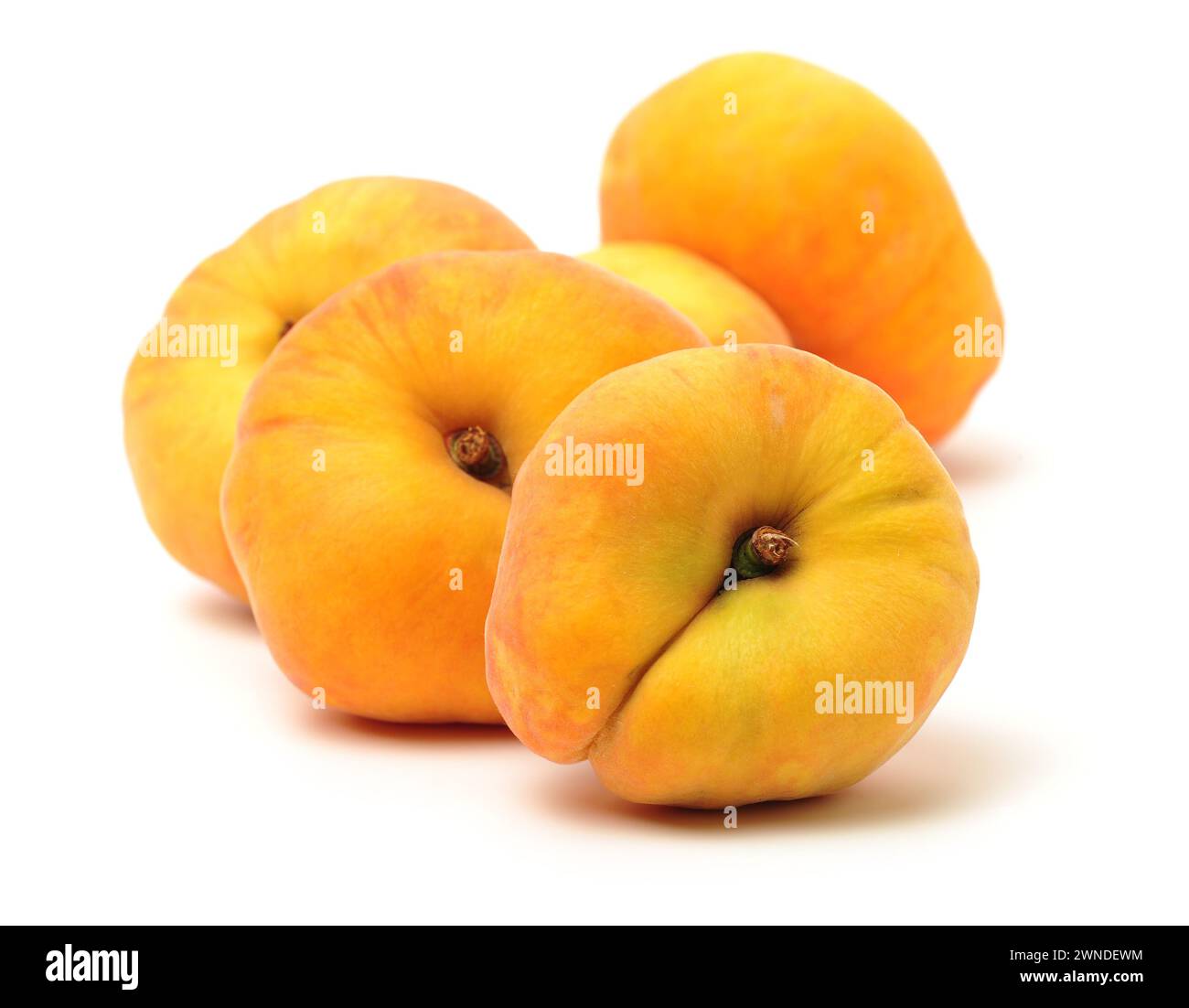 chinese flat peaches on white background Stock Photo - Alamy