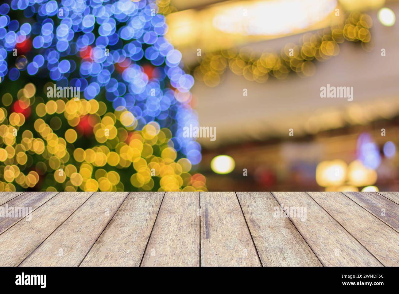 Christmas Light Bokeh background with wood floor Stock Photo - Alamy