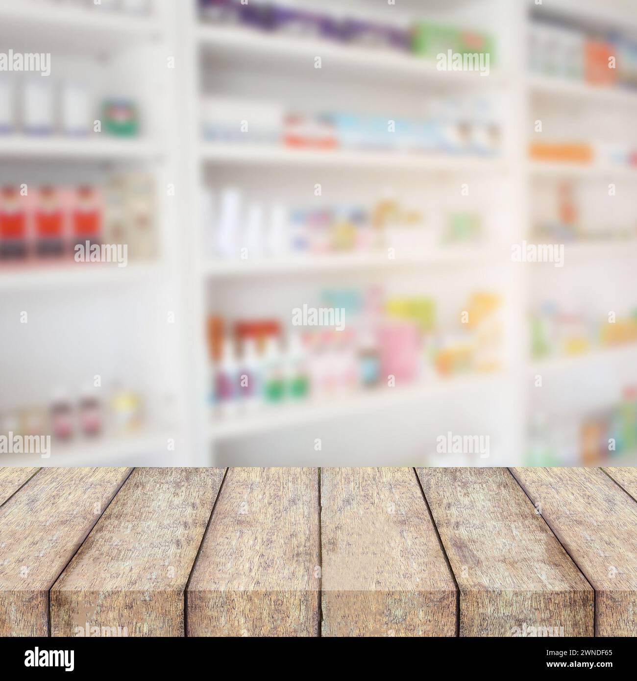 wood counter with blur shelves of drug in the pharmacy drugstore ...