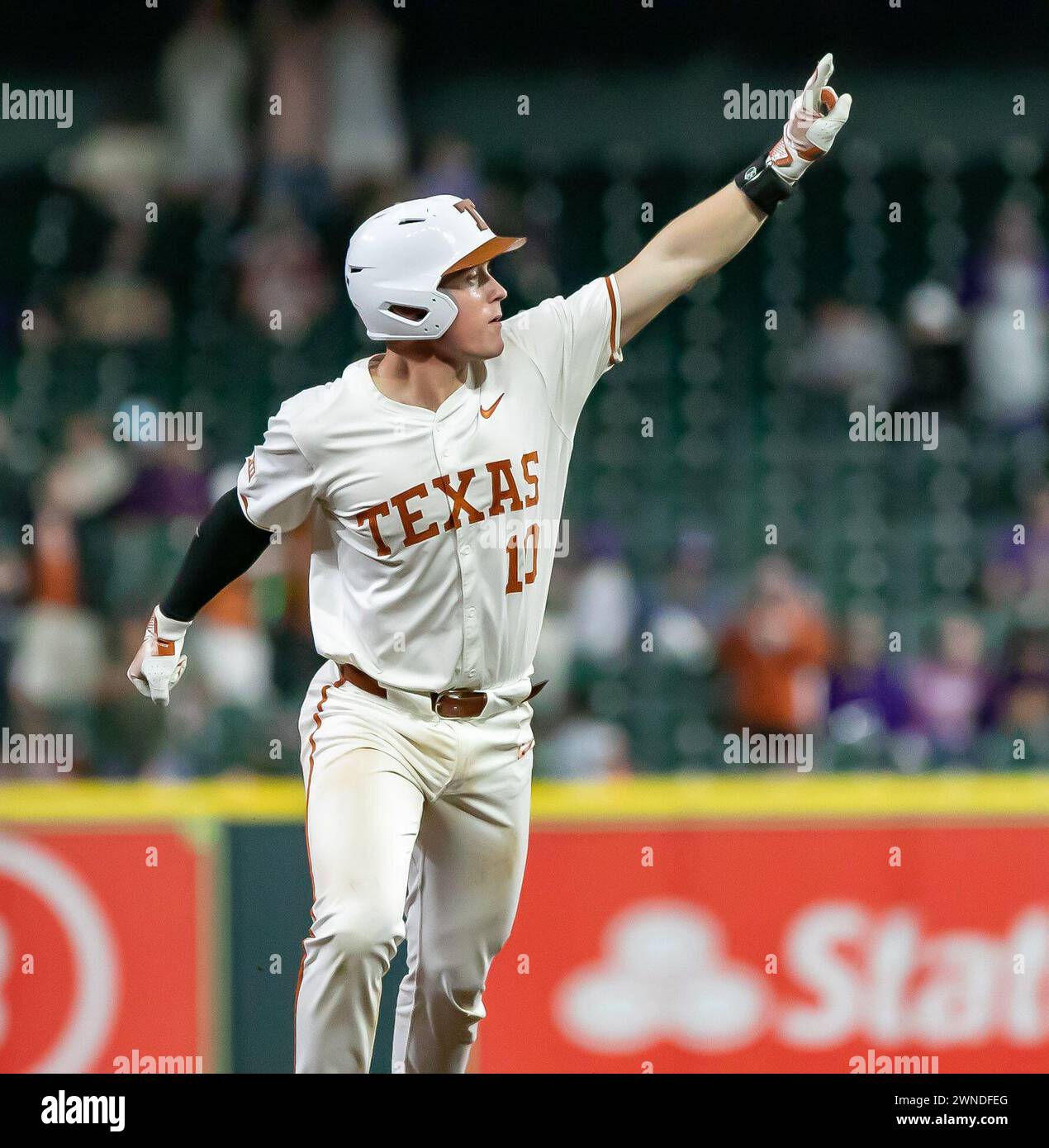 Houston, Texas, USA. 1st Mar, 2024. Texas catcher KIMBLE SCHUESSLER (10) throws up hook em horns ...