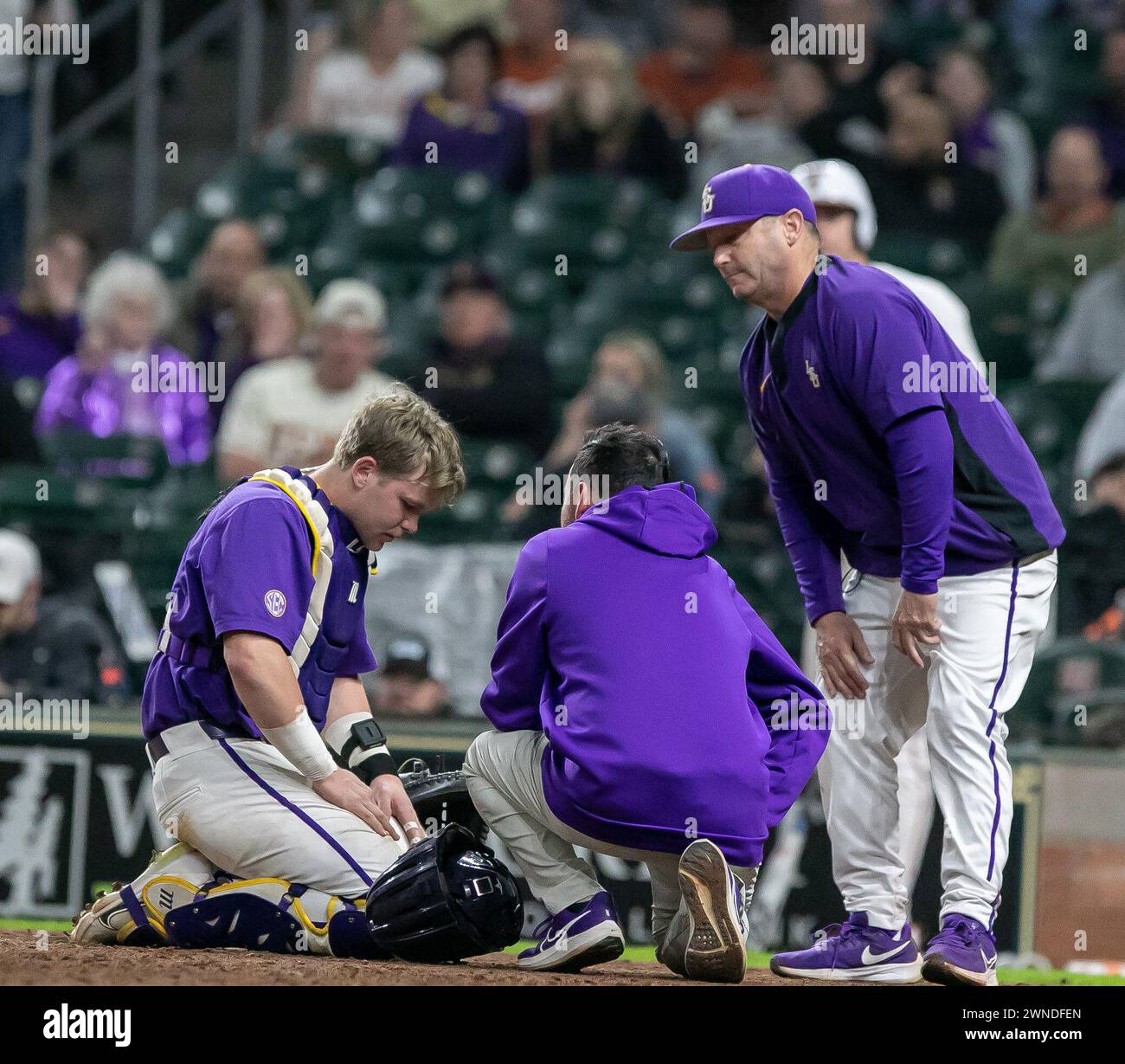 Houston, Texas, USA. 1st Mar, 2024. LSU training staff check on catcher BRADY NEAL (16) after ...