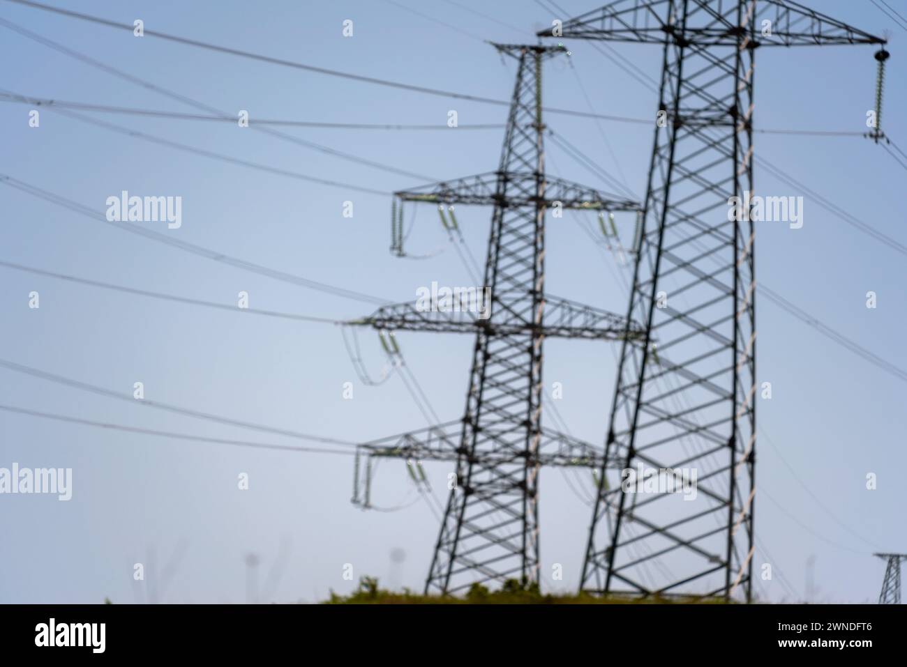 High voltage towers with sky background. Power line support with wires ...