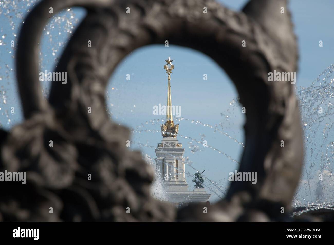 The beautiful spire of the pompous exhibition pavilion at VDNKh through ...