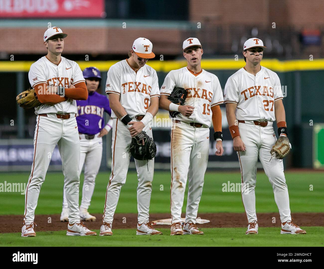 Houston, Texas, USA. 1st Mar, 2024. Texas infielders watch the relief pitcher warmup during ...