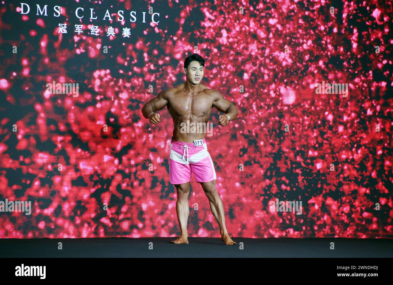 SHANGHAI, CHINA - MARCH 2, 2024 - A fitness enthusiast flexes his ...