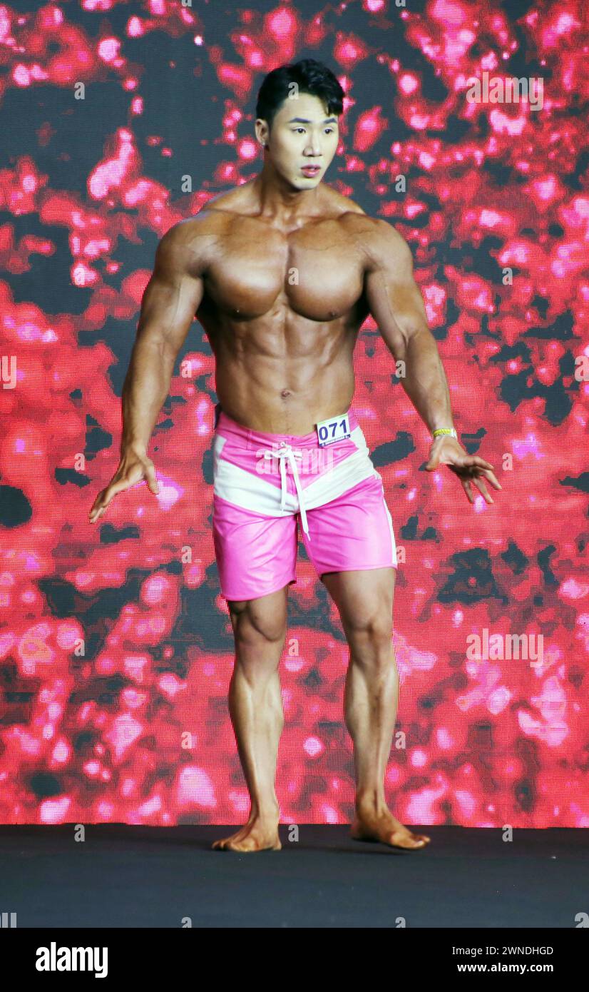 SHANGHAI, CHINA - MARCH 2, 2024 - A fitness enthusiast flexes his ...