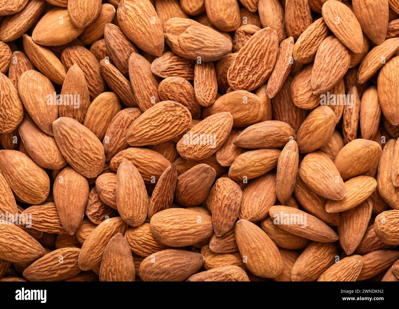 Healthy organic whole almonds nuts top view macro background texture ...