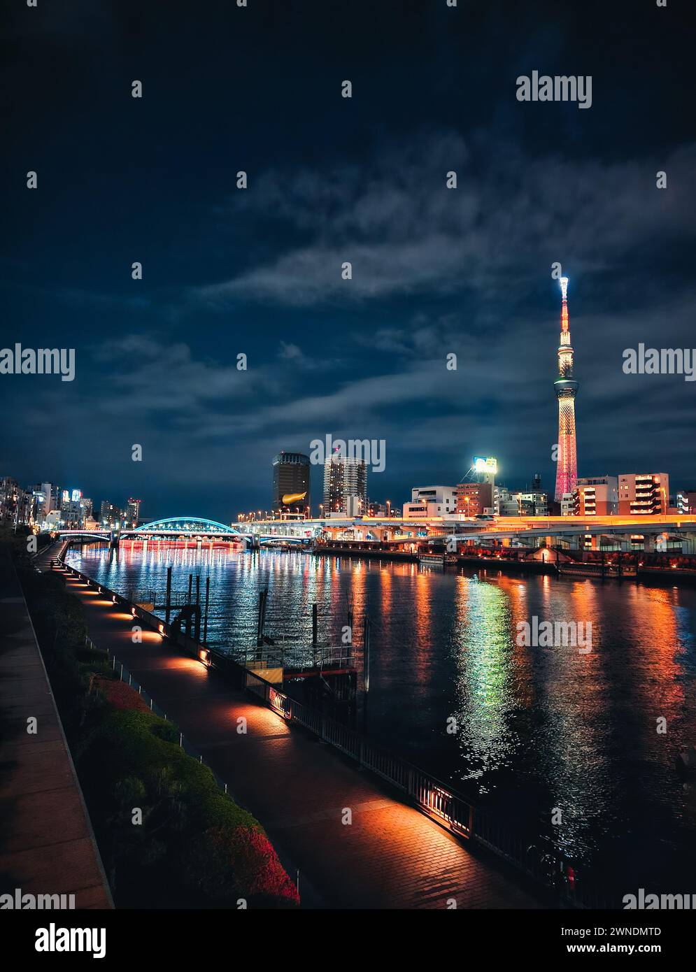 Tokyo Tower At Night Over The Water Stock Photo - Alamy