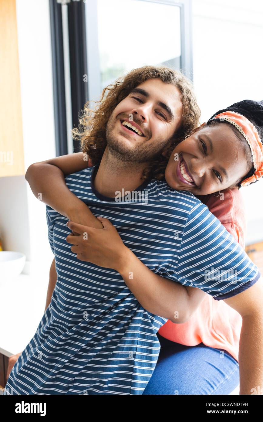 Diverse Couple Young African American Woman Embraces A Young Caucasian