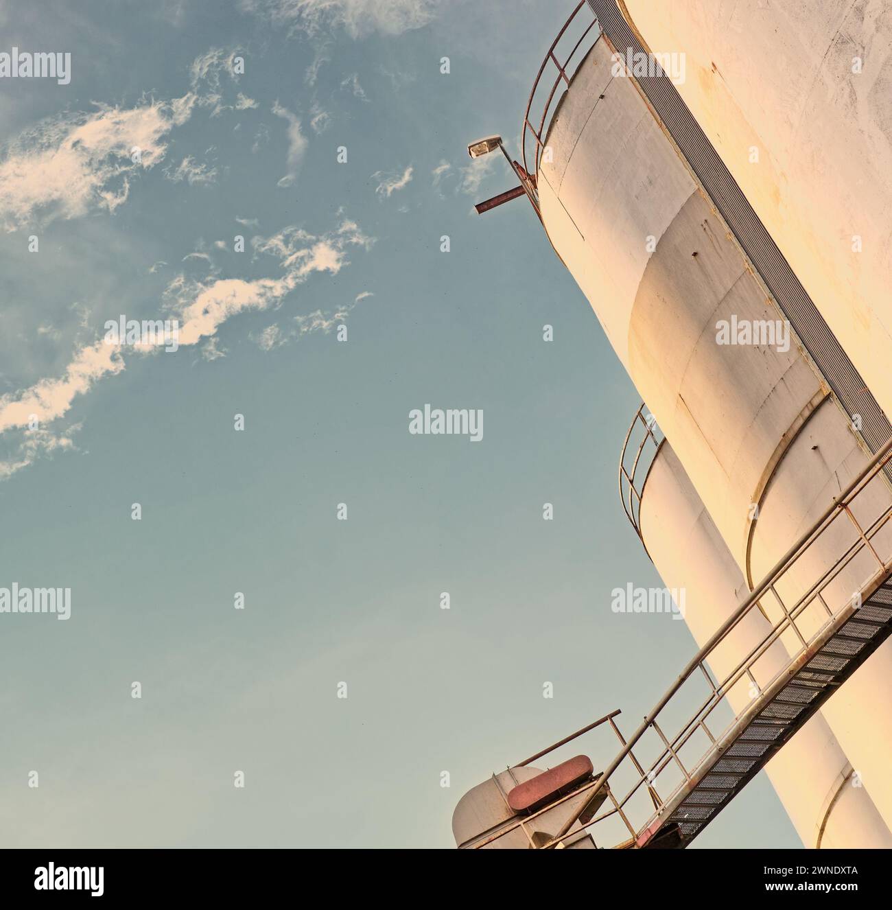 Closeup, silo and tank at plant for agriculture, bulk storage and ...