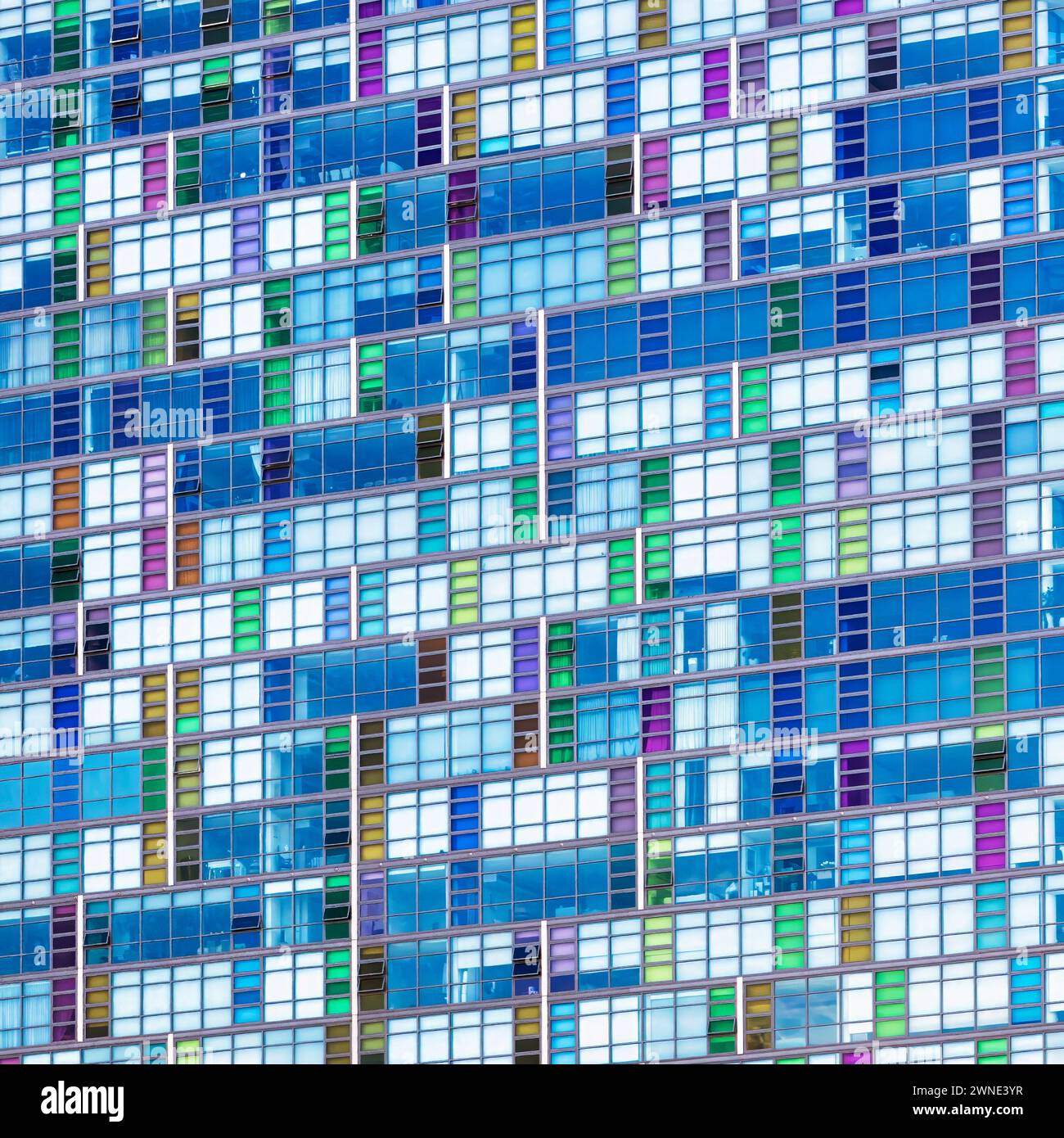 A wall of many windows and reflections, looking up at the exterior of ...