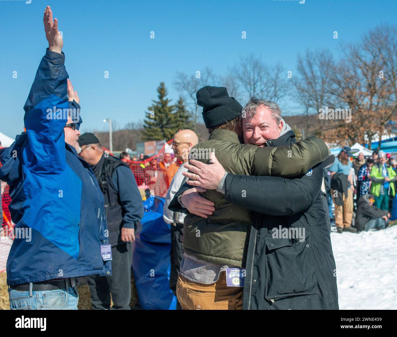 Participants react after sledding down the mountain in their themed ...