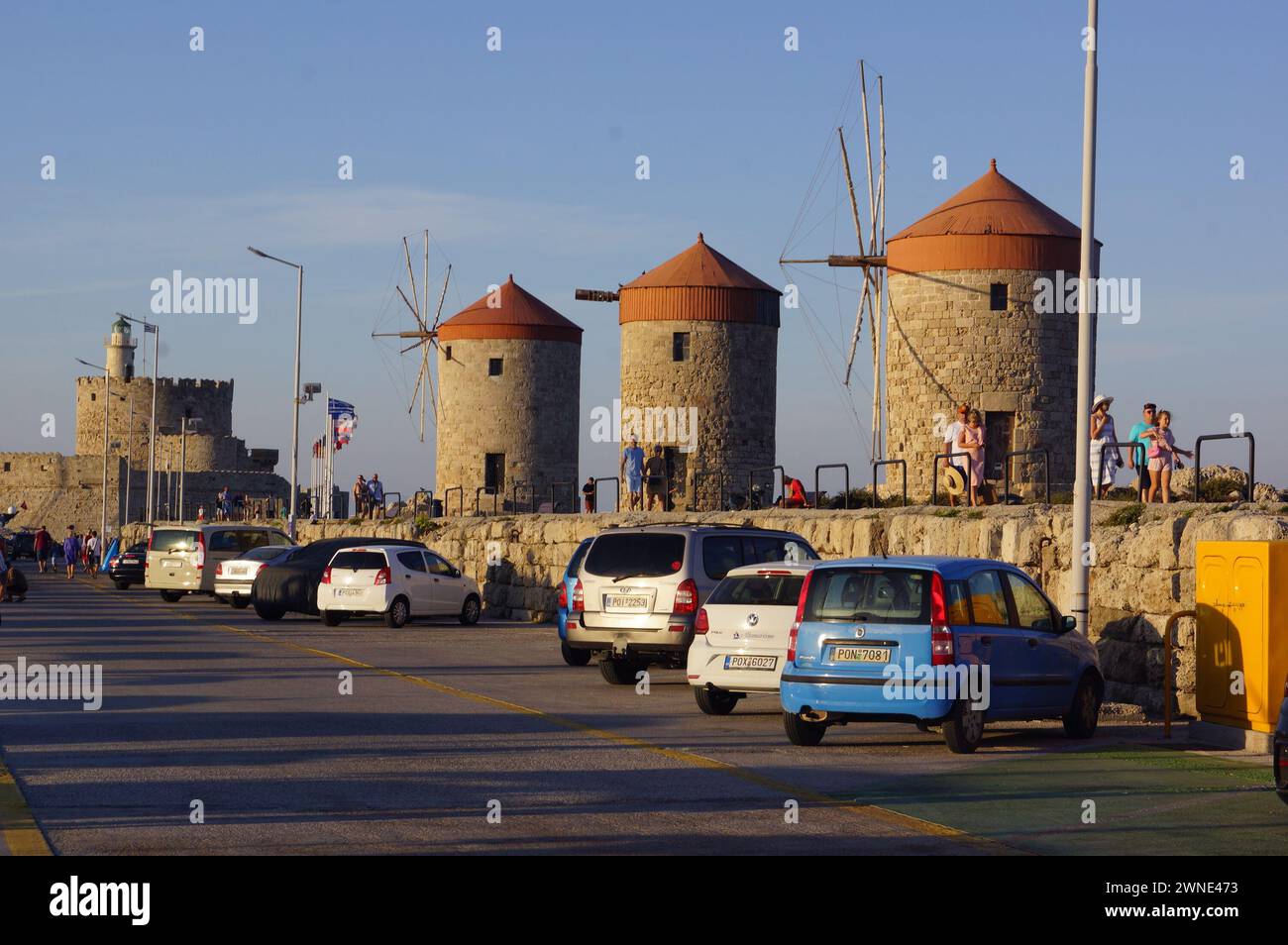 The three iconic medieval windmills in Mandraki Harbour in Rhodes ...