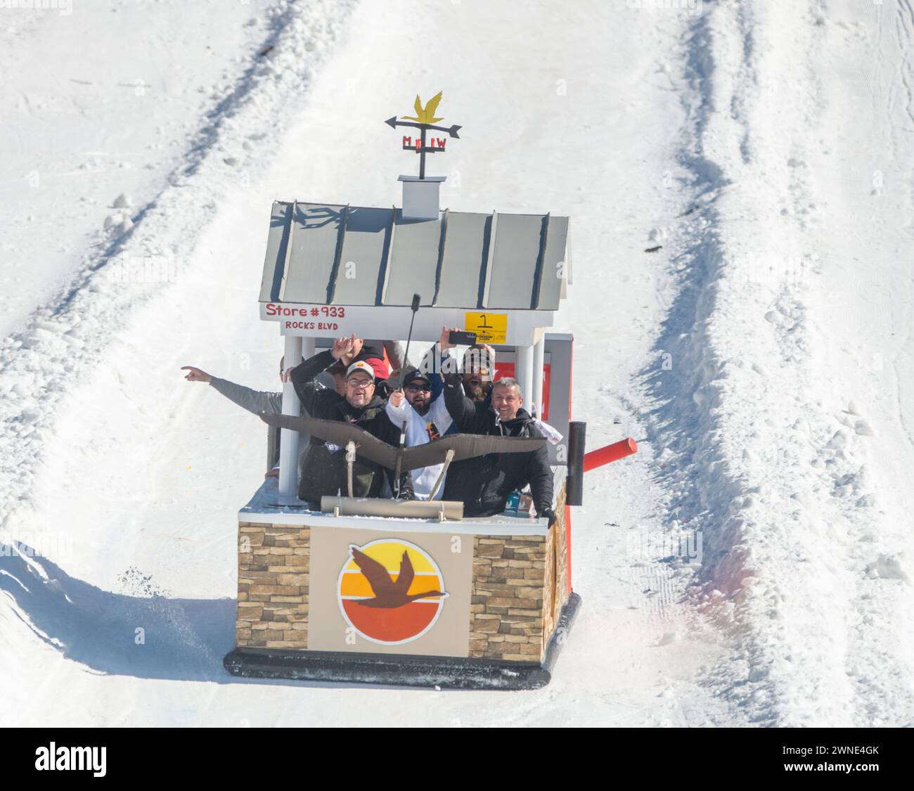 Participants react after sledding down the mountain in their Wawa ...