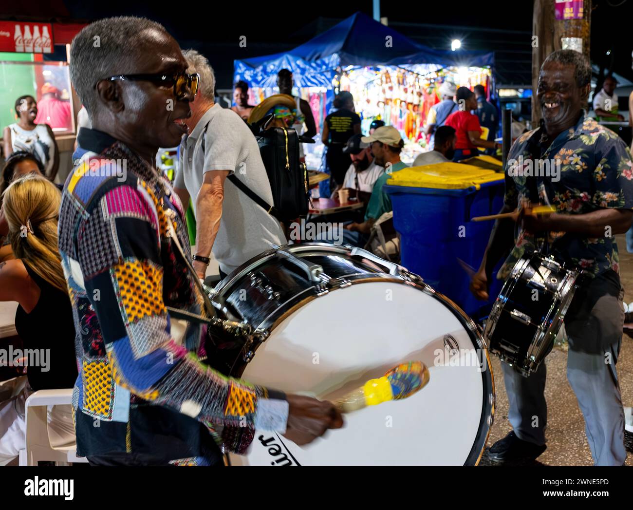 A pair of drummers livening up the carnival atmosphere at Oistins fish ...