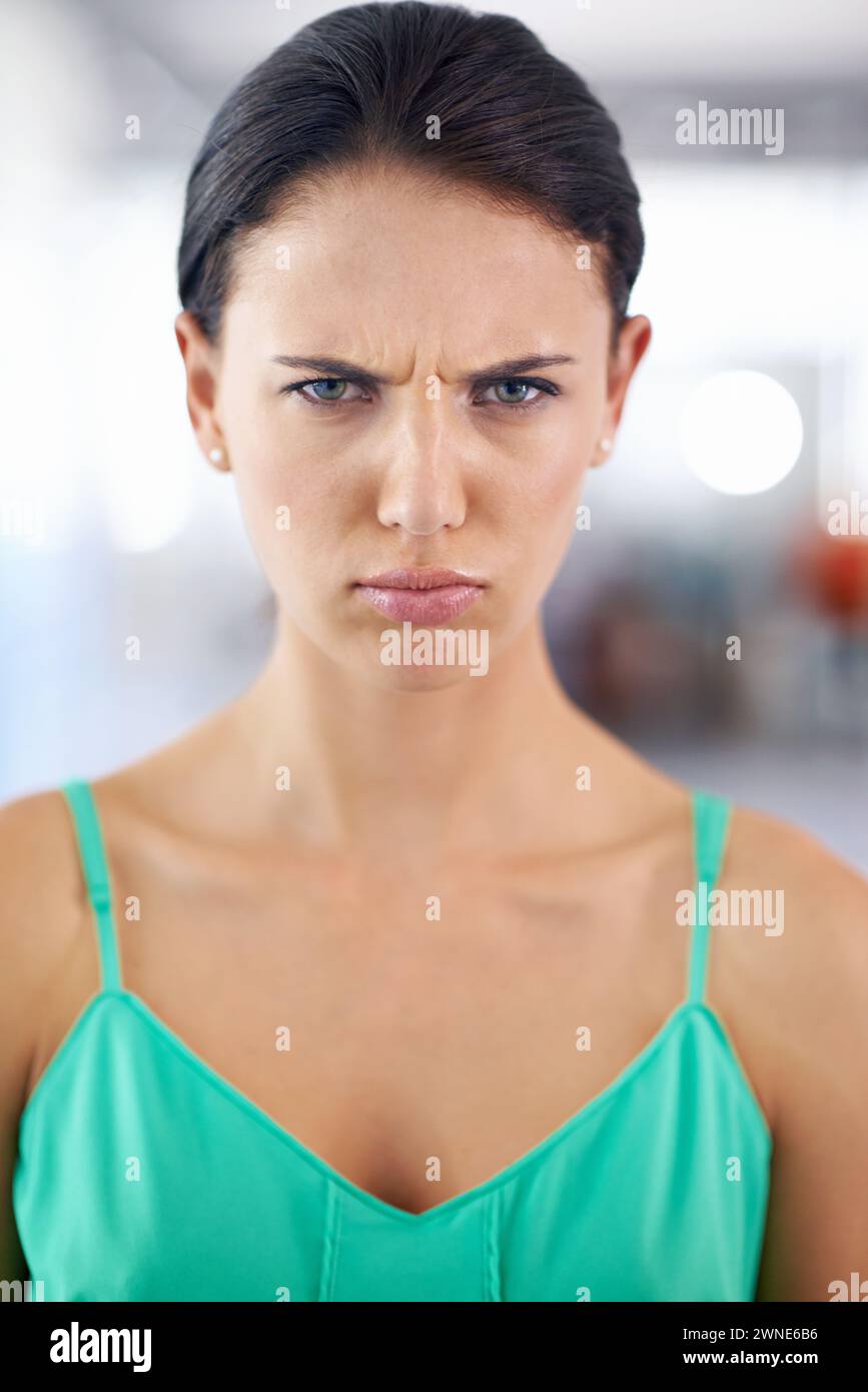 Portrait, frown and angry with woman, stress and emotions with expression and frustrated. Face ...