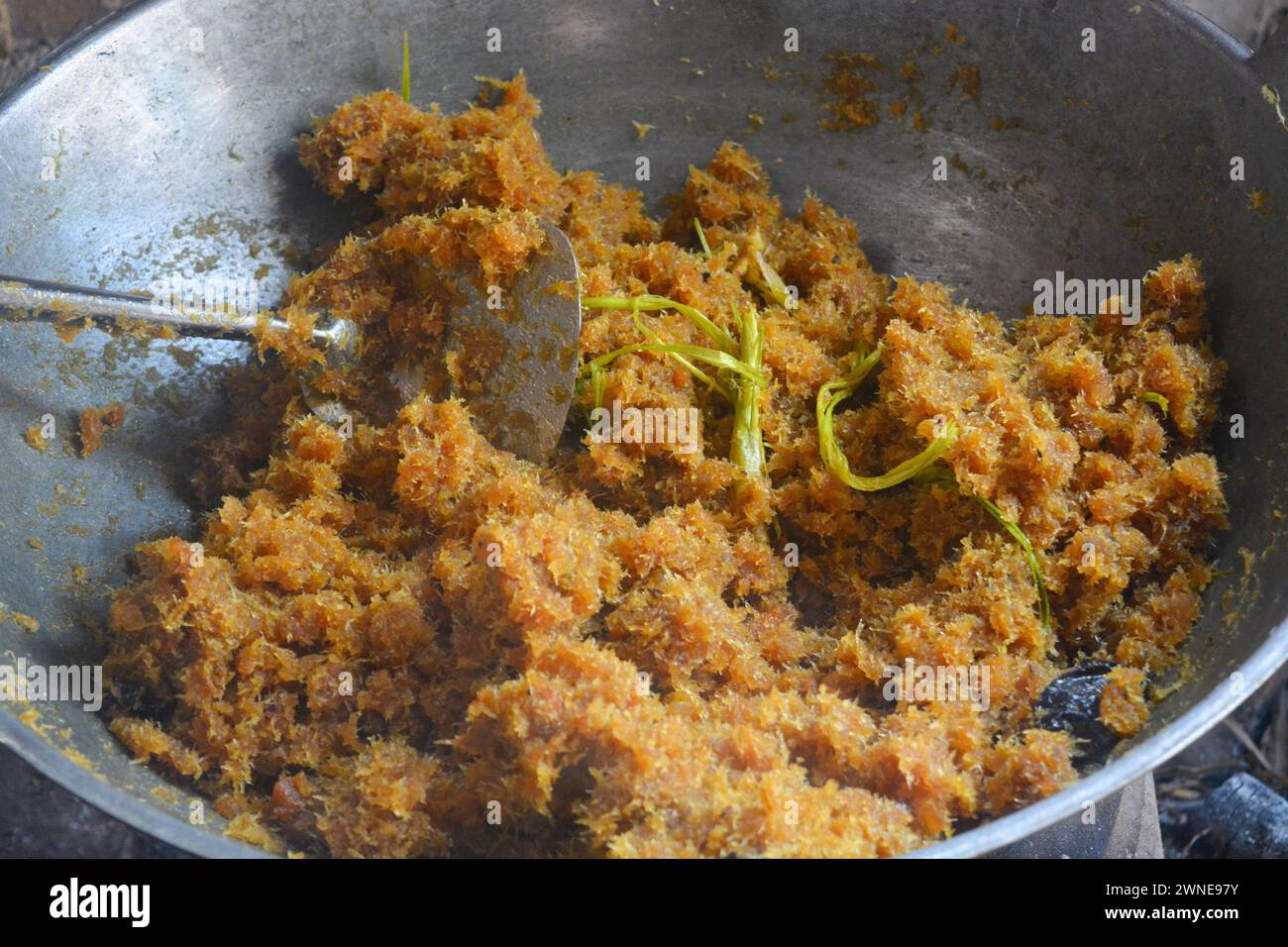 The process of making serundeng made from shaved coconut dregs, a ...