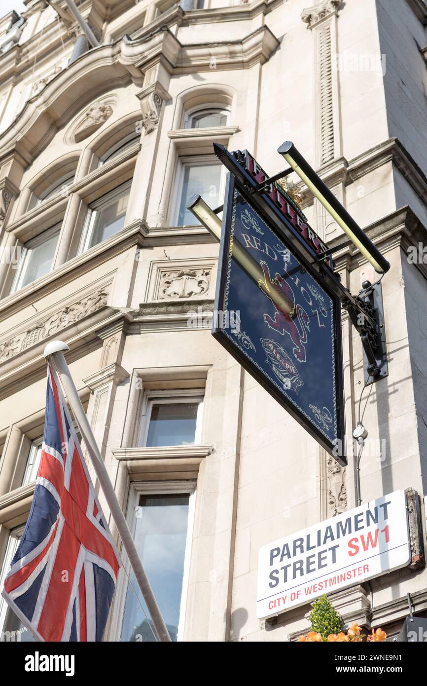 UK, London, the Red Lion pub sign, Parliament Street sign and British ...