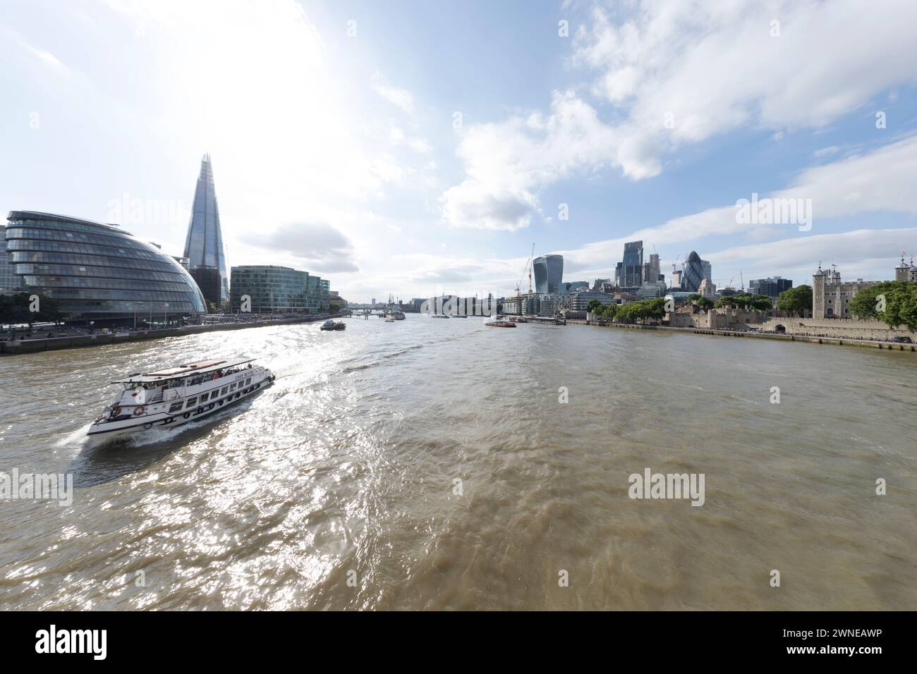 UK, London, sightseeing tourist boat cruising the river Thames and ...