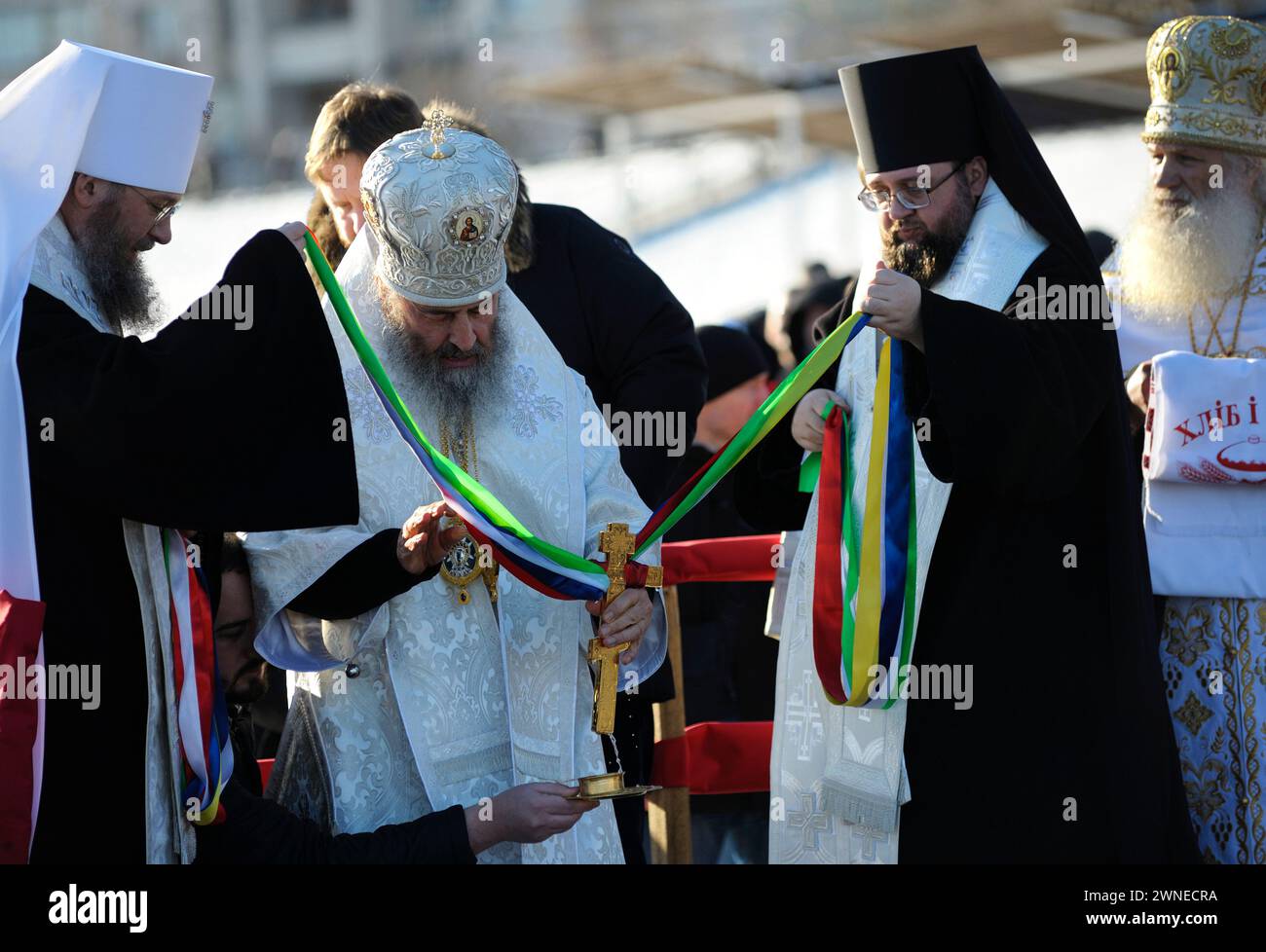 Ukrainian Orthodox Church priest Metropolitan Onufriy taking water with ...