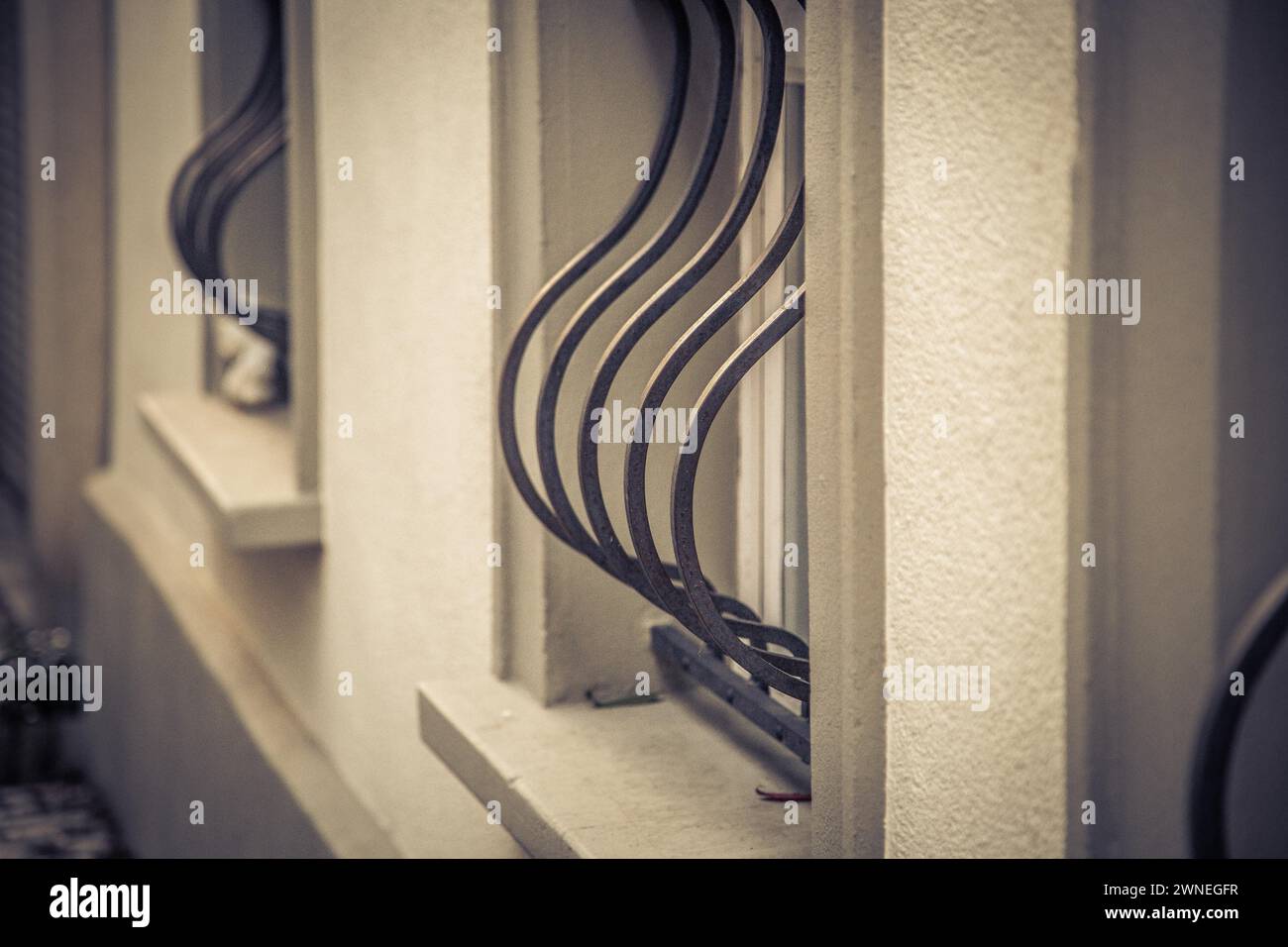 Curved iron window grille as a security and design element, On the ...