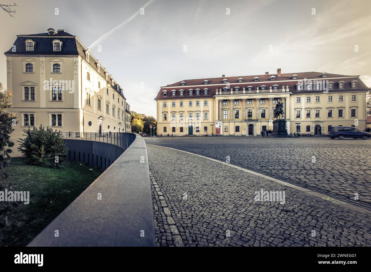 Wide square in front of historic buildings at dusk, On the streets in ...