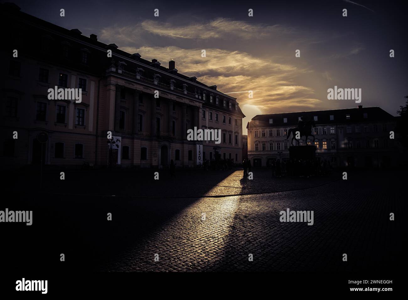 Sunset over a historic square and building, On the streets in Weimar ...