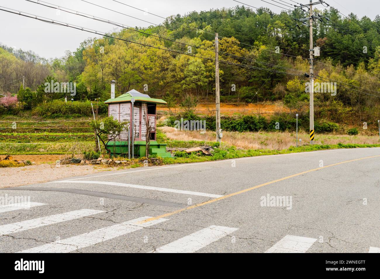 Old dilapidated public toilet on rural roadside in small farming ...