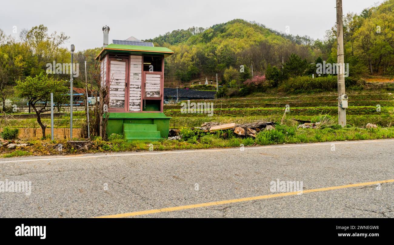 Old dilapidated public toilet on rural roadside in small farming ...