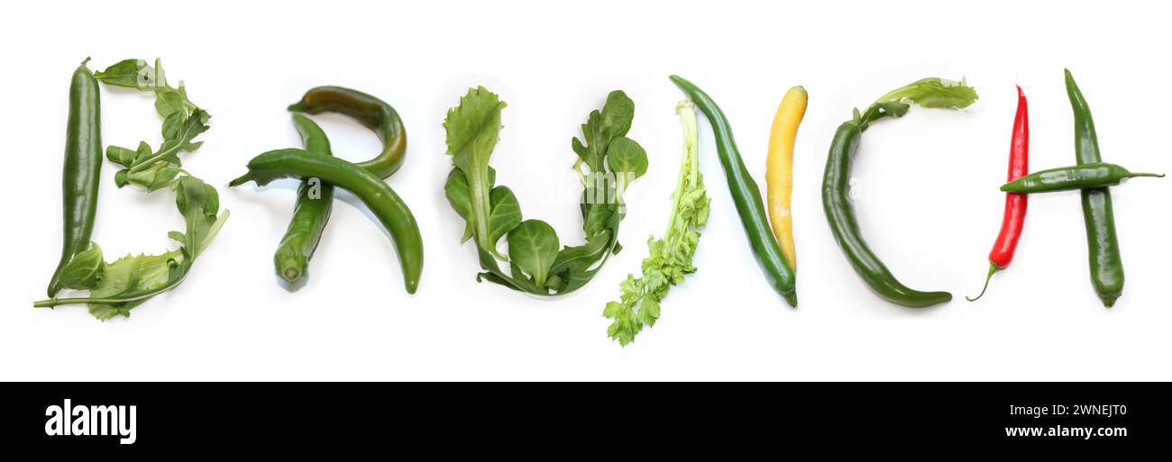 word BRUNCH from green red chili peppers, yellow carrot, celery stick ...