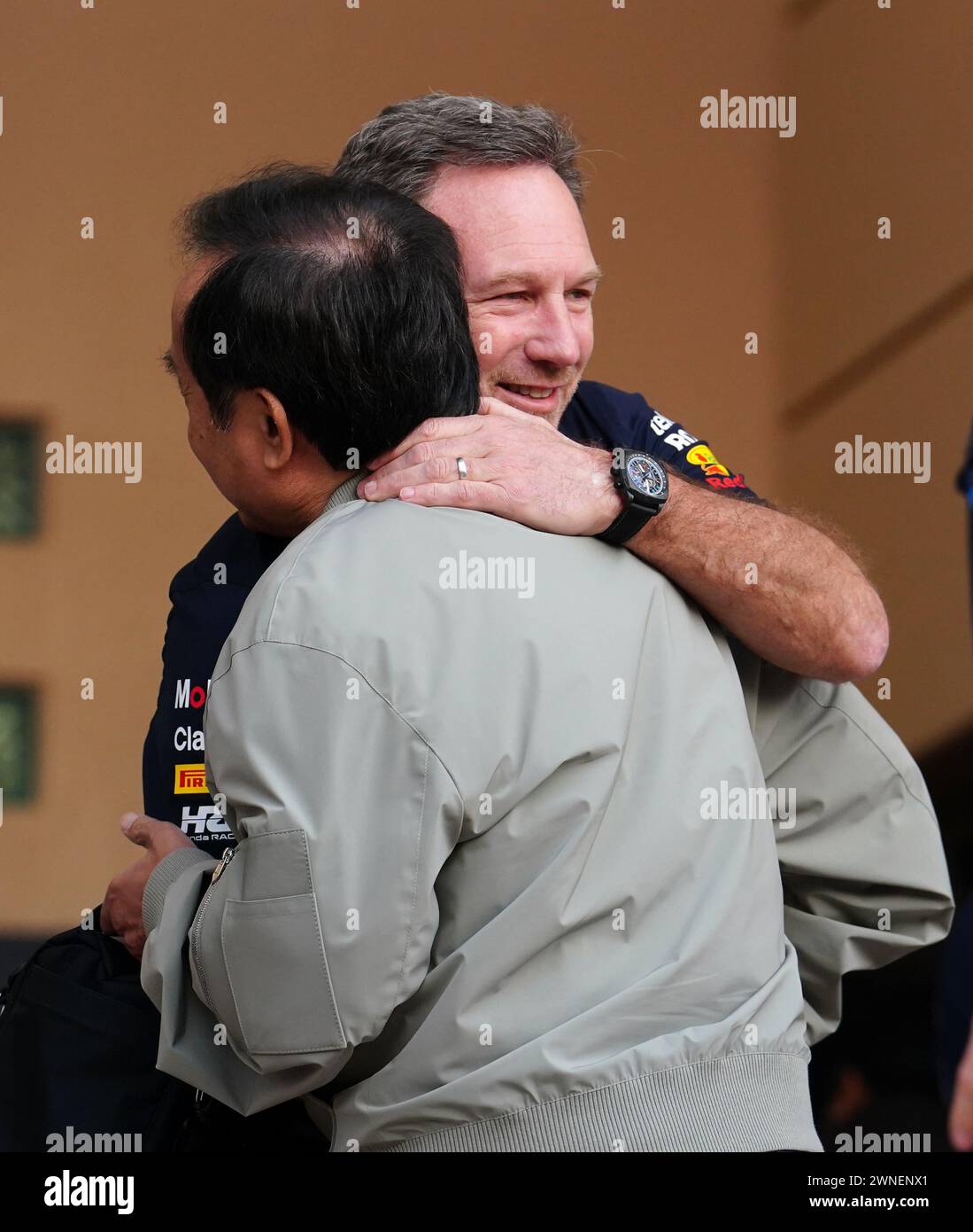 Co-owner of Red Bull Chalerm Yoovidhya hugs Red Bull Racing team principal Christian Horner ...