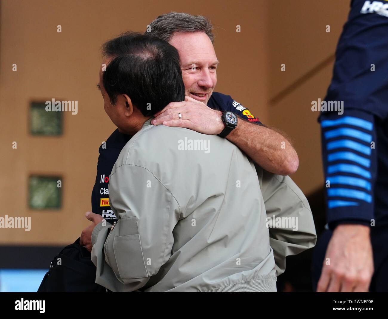Co-owner of Red Bull Chalerm Yoovidhya hugs Red Bull Racing team principal Christian Horner ...