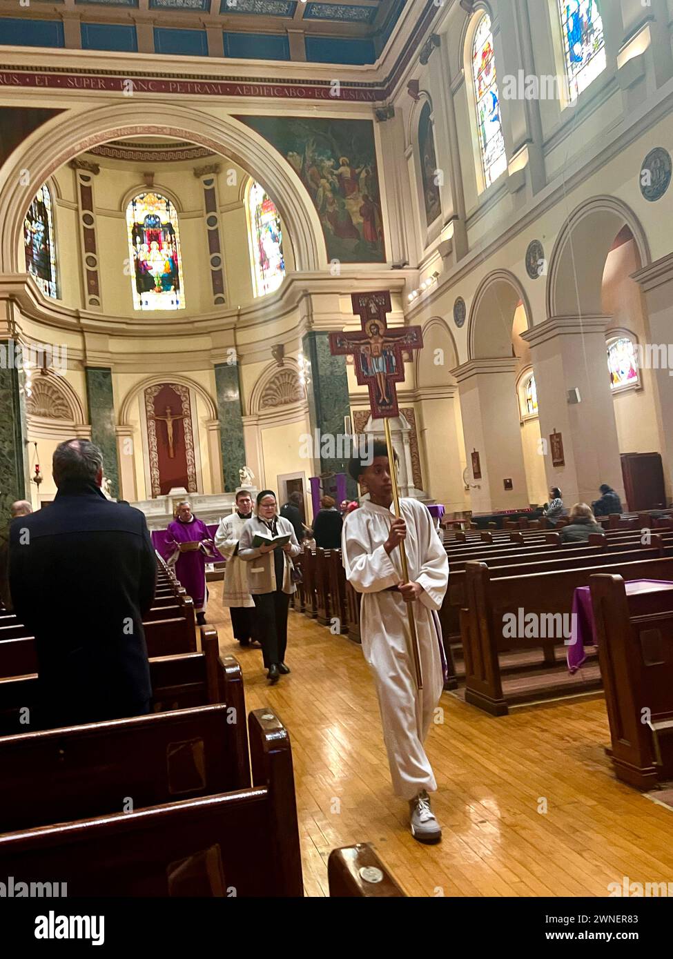 Clergy begins mass with a procession to the alter at a Catholic Church ...