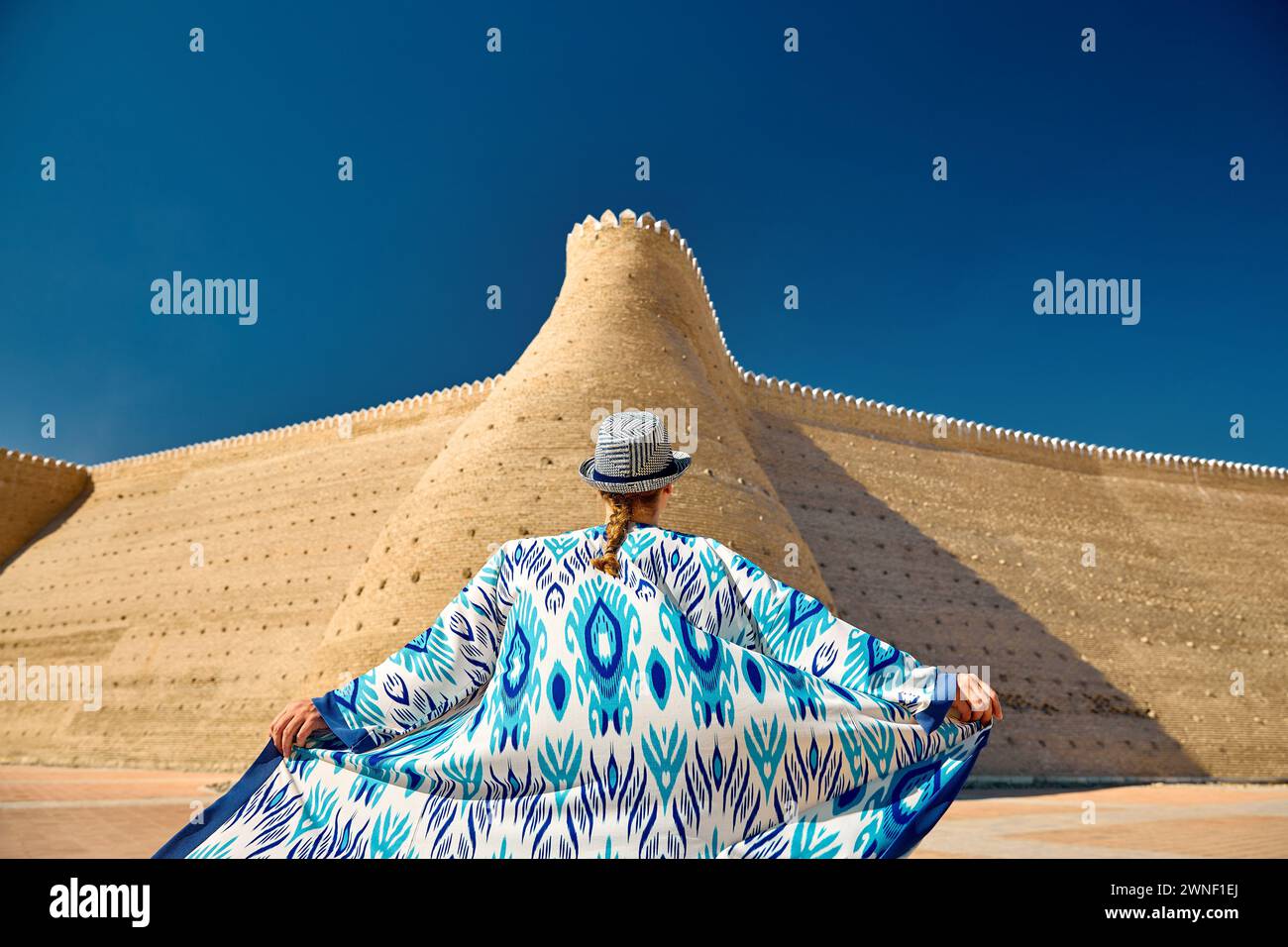 Woman in ethnic dress with blue traditional pattern near Walls of the ...