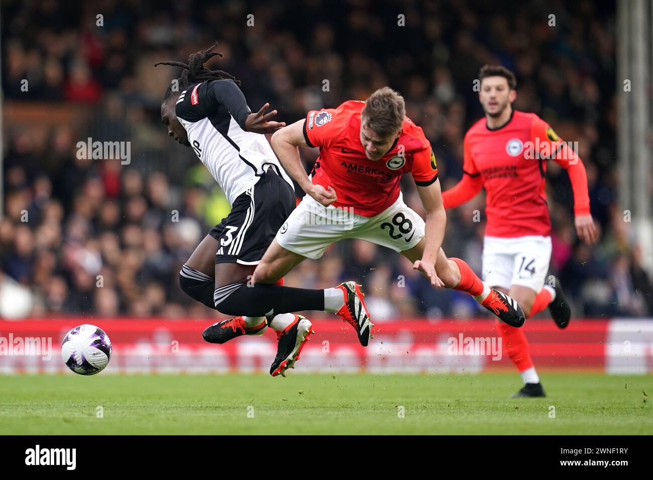 Fulham's Calvin Bassey (left) and Brighton and Hove Albion's Evan ...