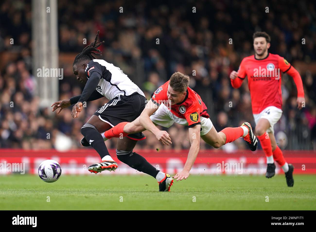 Fulham's Calvin Bassey (left) and Brighton and Hove Albion's Evan ...