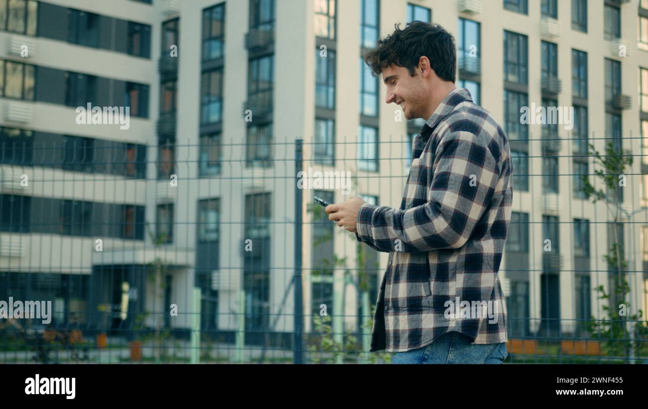 Happy smart casual man walking hi-res stock photography and images - Alamy