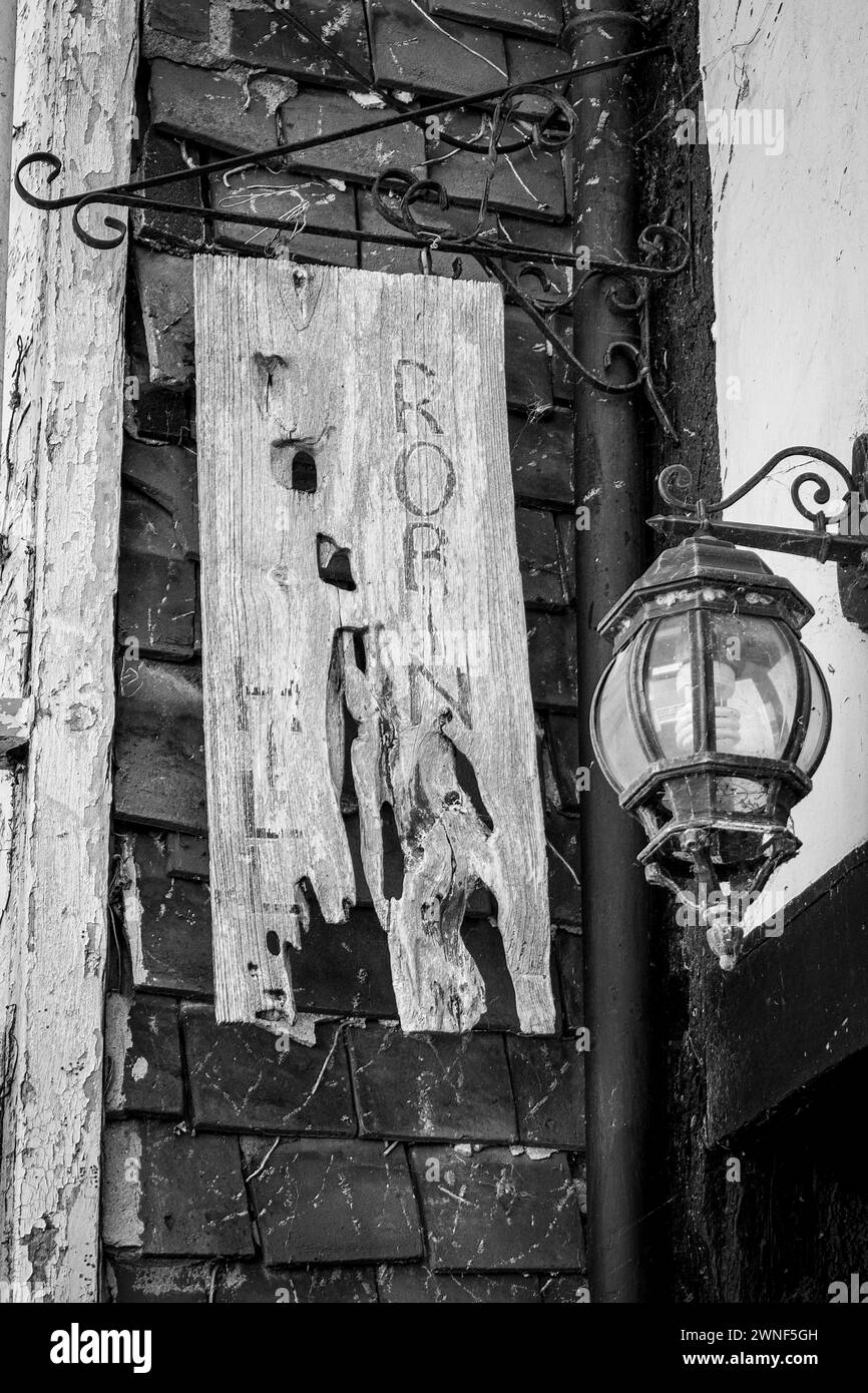An old, heavily eroded wooden sign for Robin Hill, a house on Mermaid ...