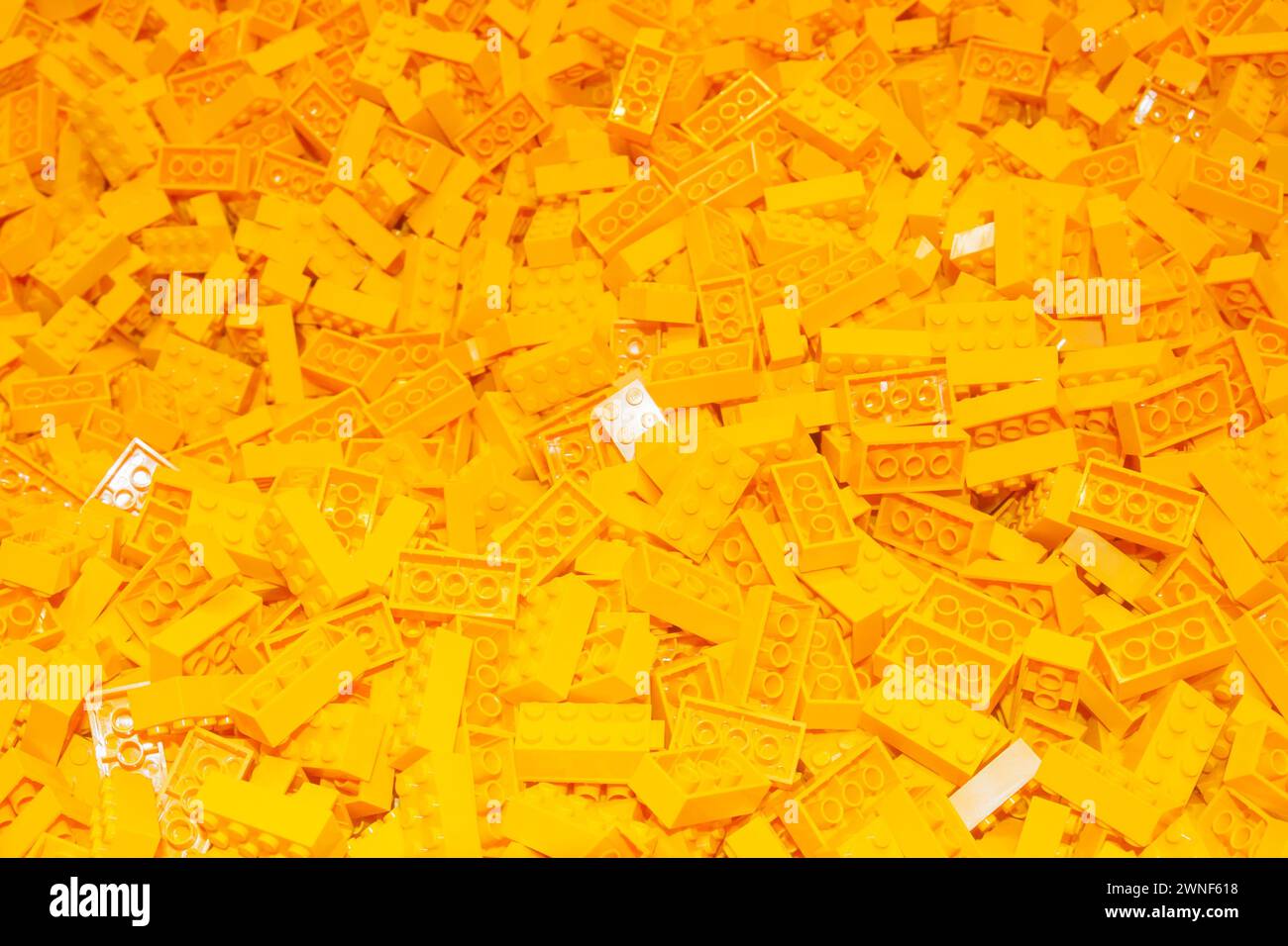 Billund, Denmark - 17 June 2023: Yellow plastic Lego brick background ...