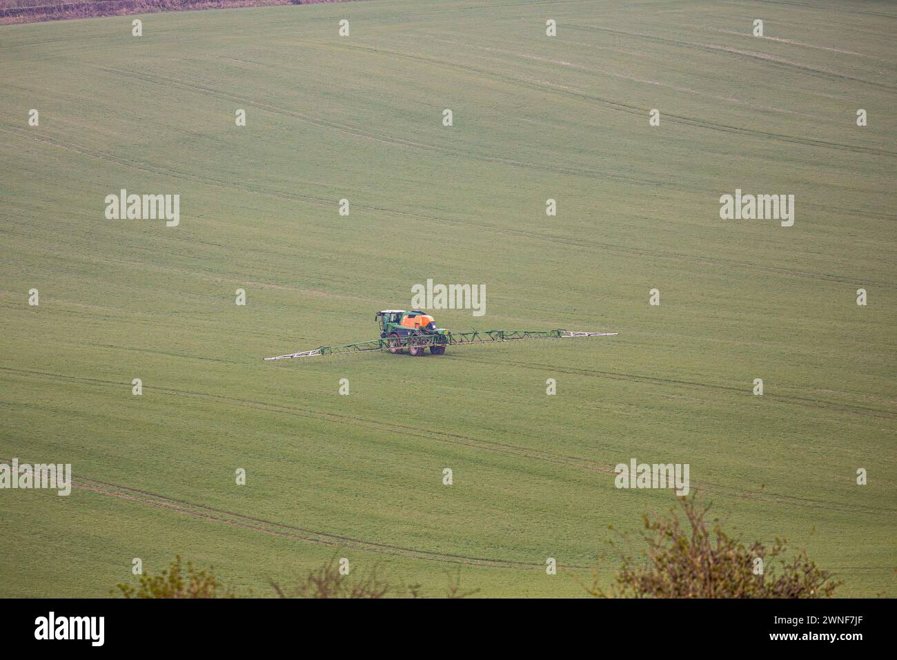 Tractor crop spraying in a wiltshire field landscape, uk farming Stock ...