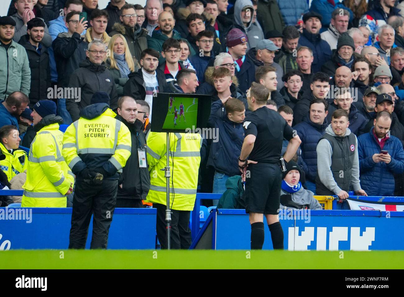 Referee Craig Pawson watches a VAR Screen to check a possible penalty ...