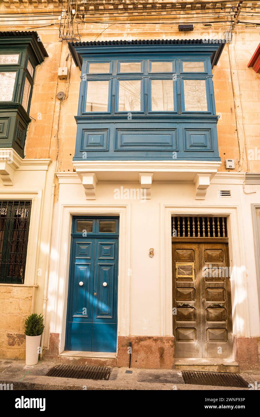 Facade of a typical house with balconies closed by typical Malta ...