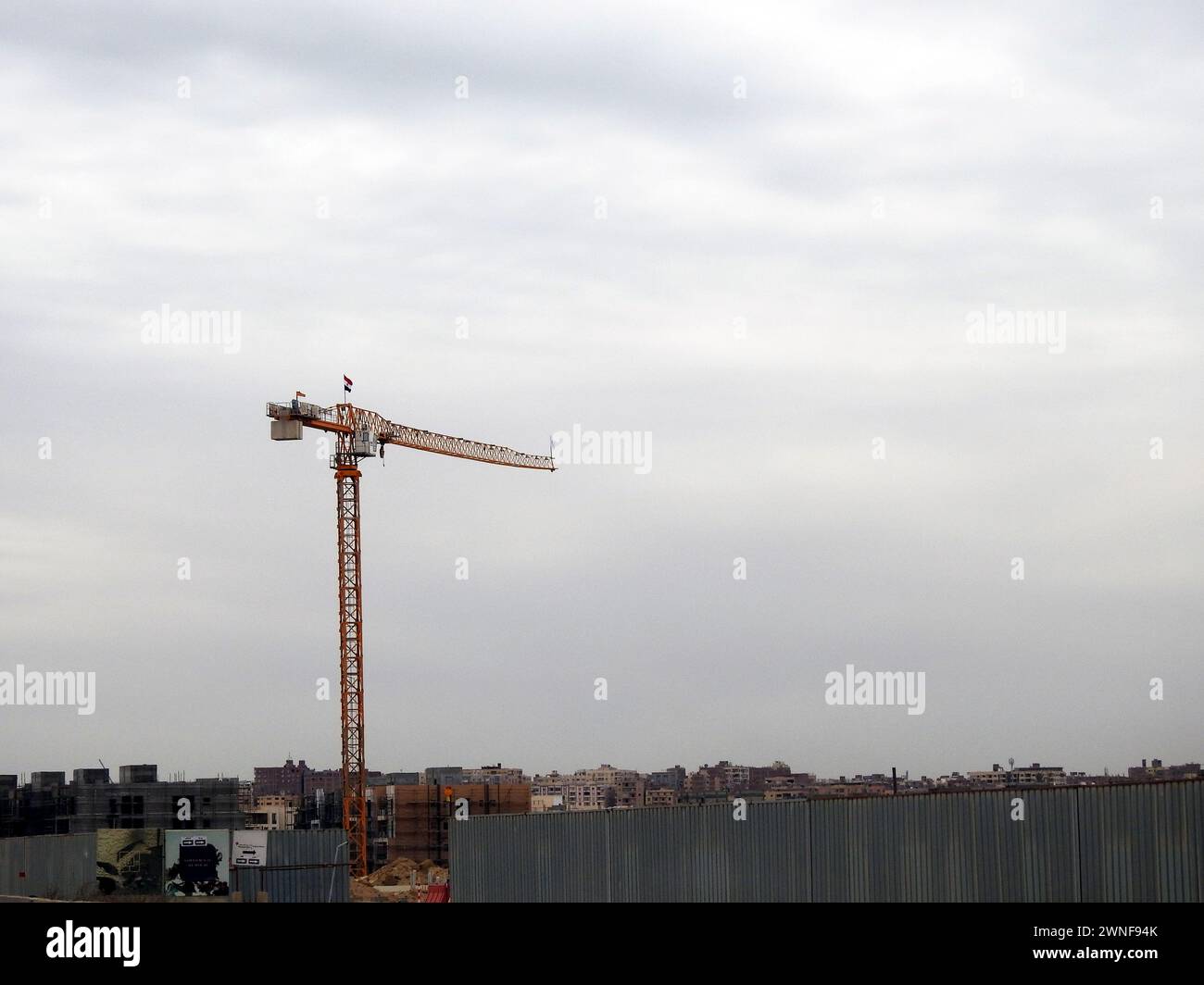 Cairo, Egypt, February 23 2024: A crane tower with the Egyptian flag ...
