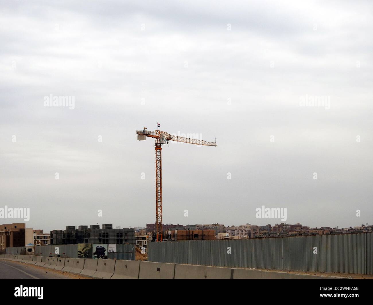 Cairo, Egypt, February 23 2024: A crane tower with the Egyptian flag waving on it, A ...