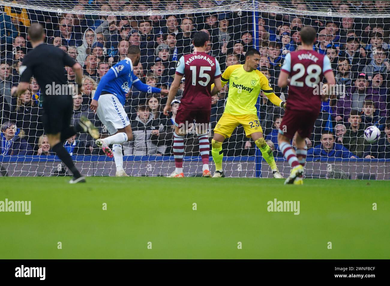 Everton's Beto (second from left) scores their side's first goal of the ...