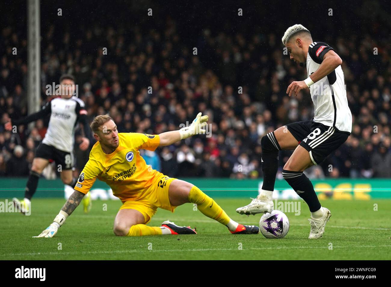 Fulham's Andreas Pereira (right) attempts to get past Brighton and Hove ...